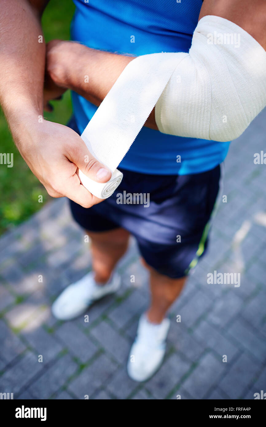Bandaging elbow joint Stock Photo - Alamy