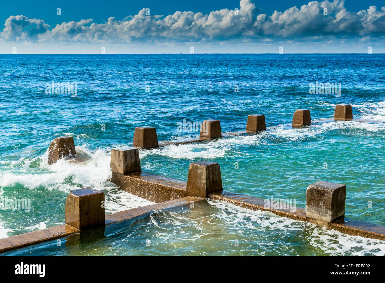 Early morning swimmers at the outdoor rock pool at Coogee Beach Sydney ...