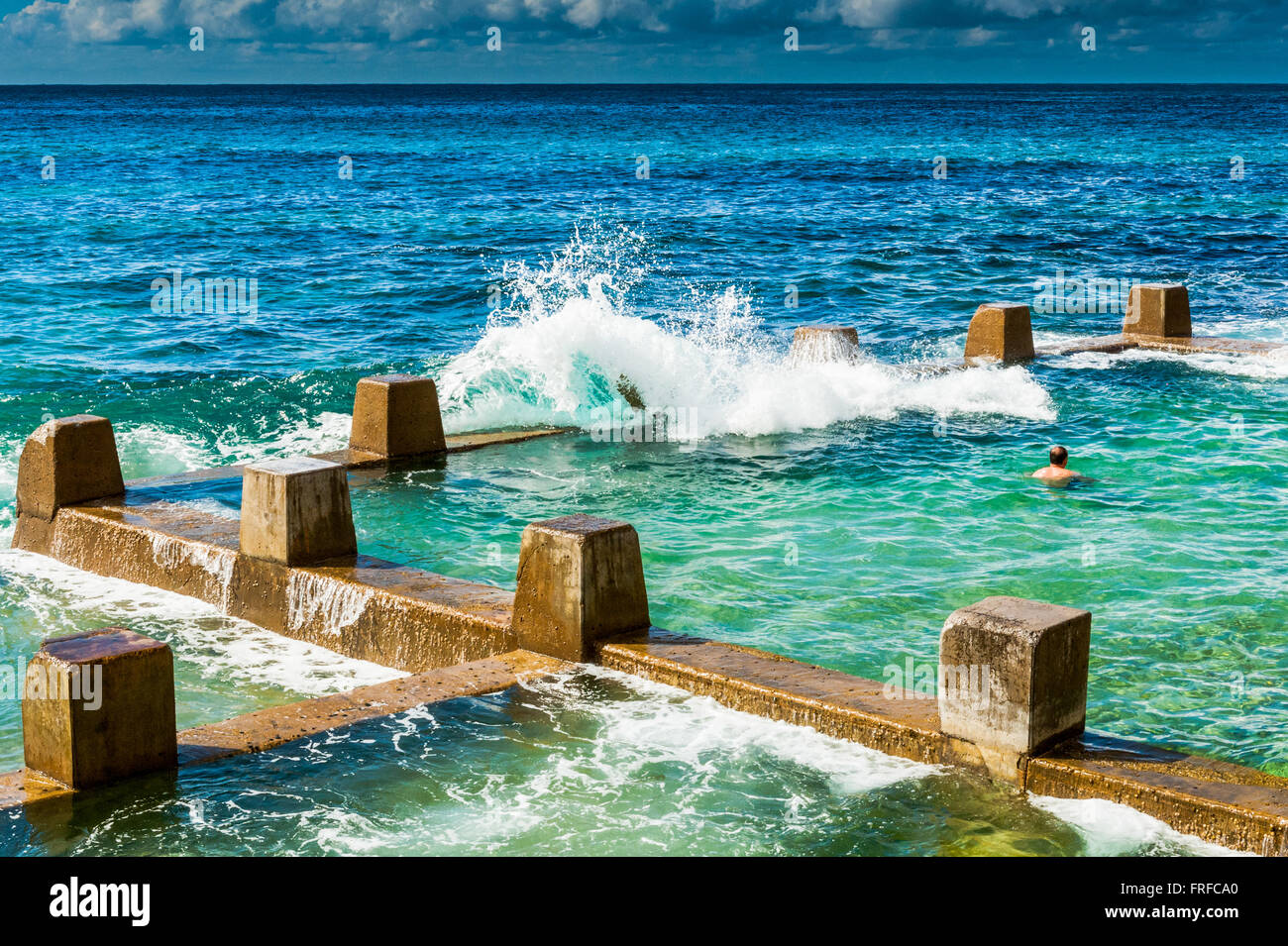 Early morning swimmers at the outdoor rock pool at Coogee Beach Sydney ...