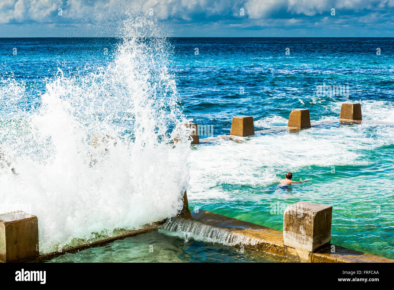 Early morning swimmers at the outdoor rock pool at Coogee Beach Sydney ...