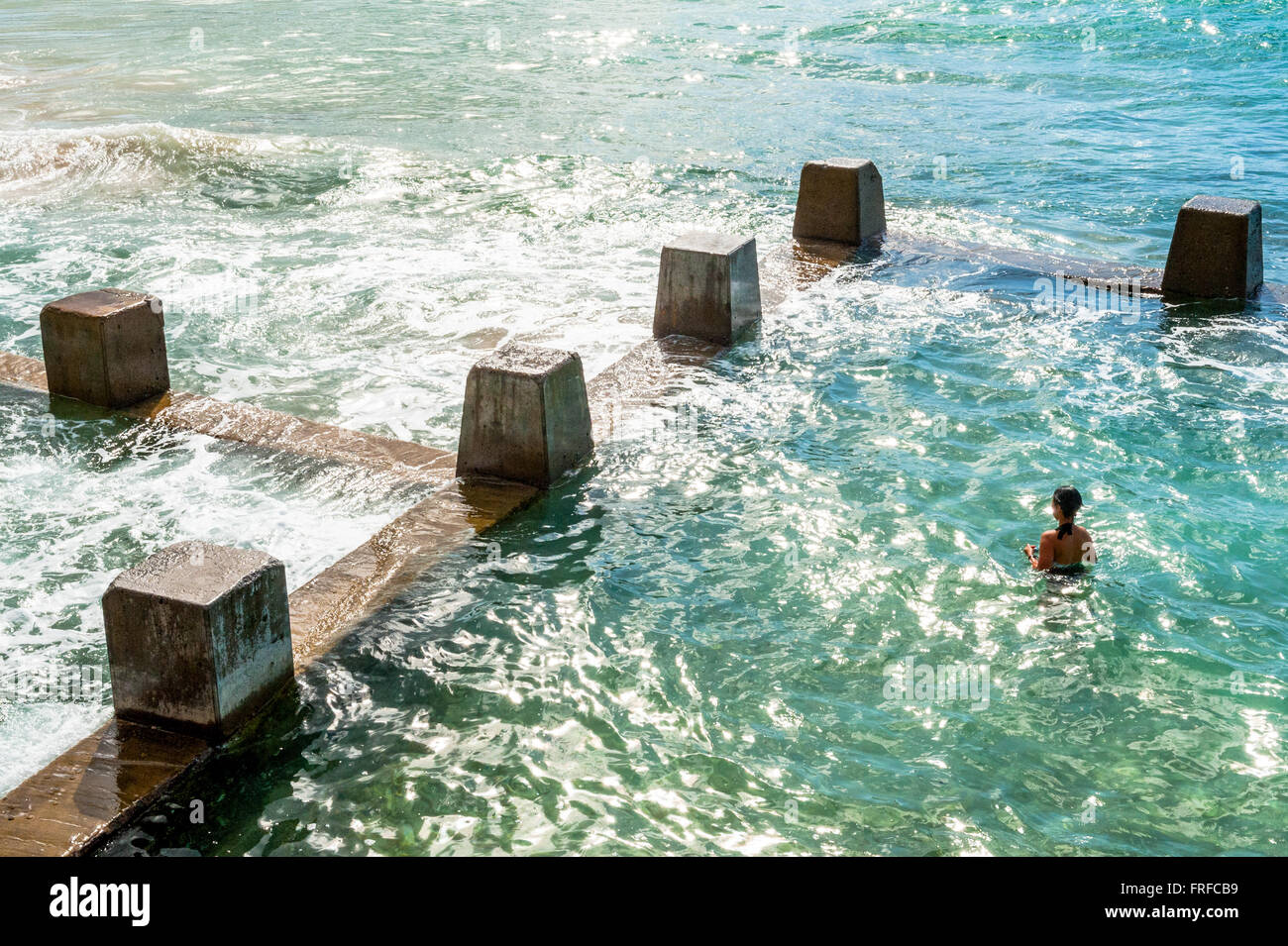 Early morning swimmers at the outdoor rock pool at Coogee Beach Sydney ...
