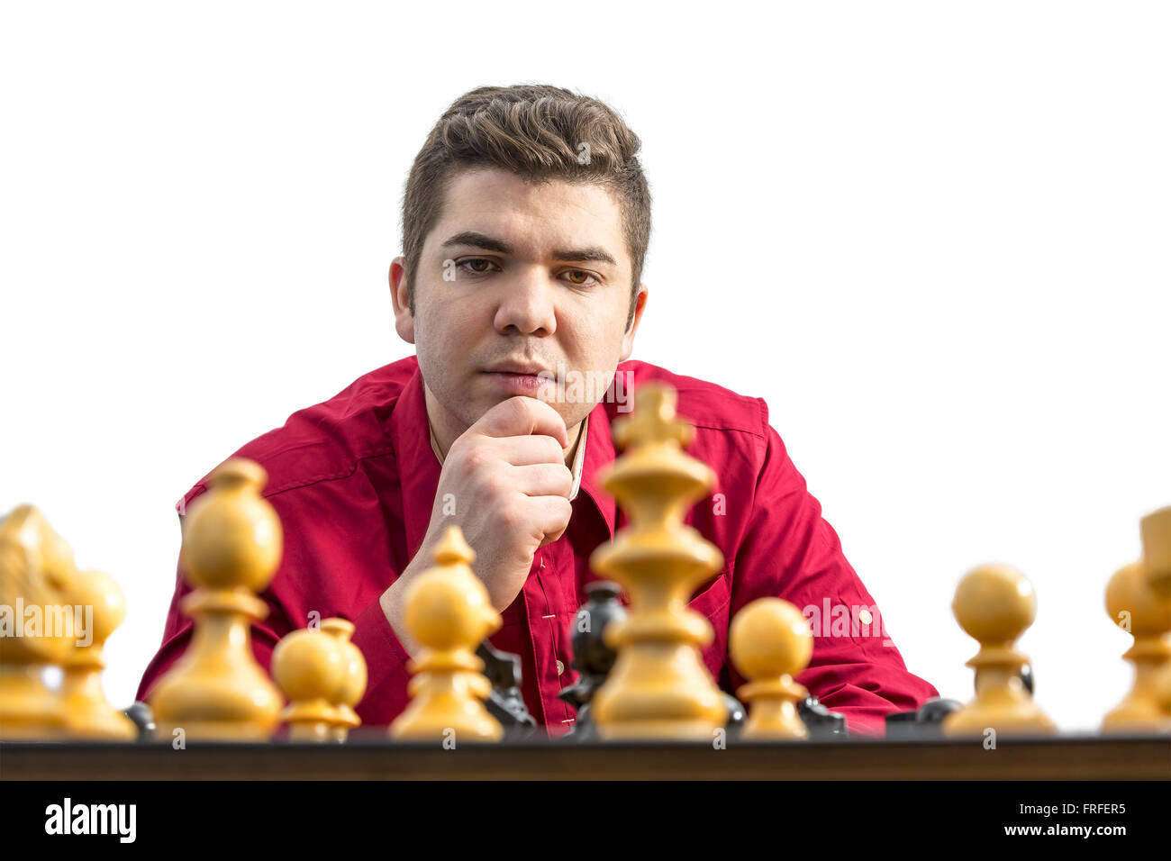 Portrait of a young man thinking during a chess match Stock Photo - Alamy