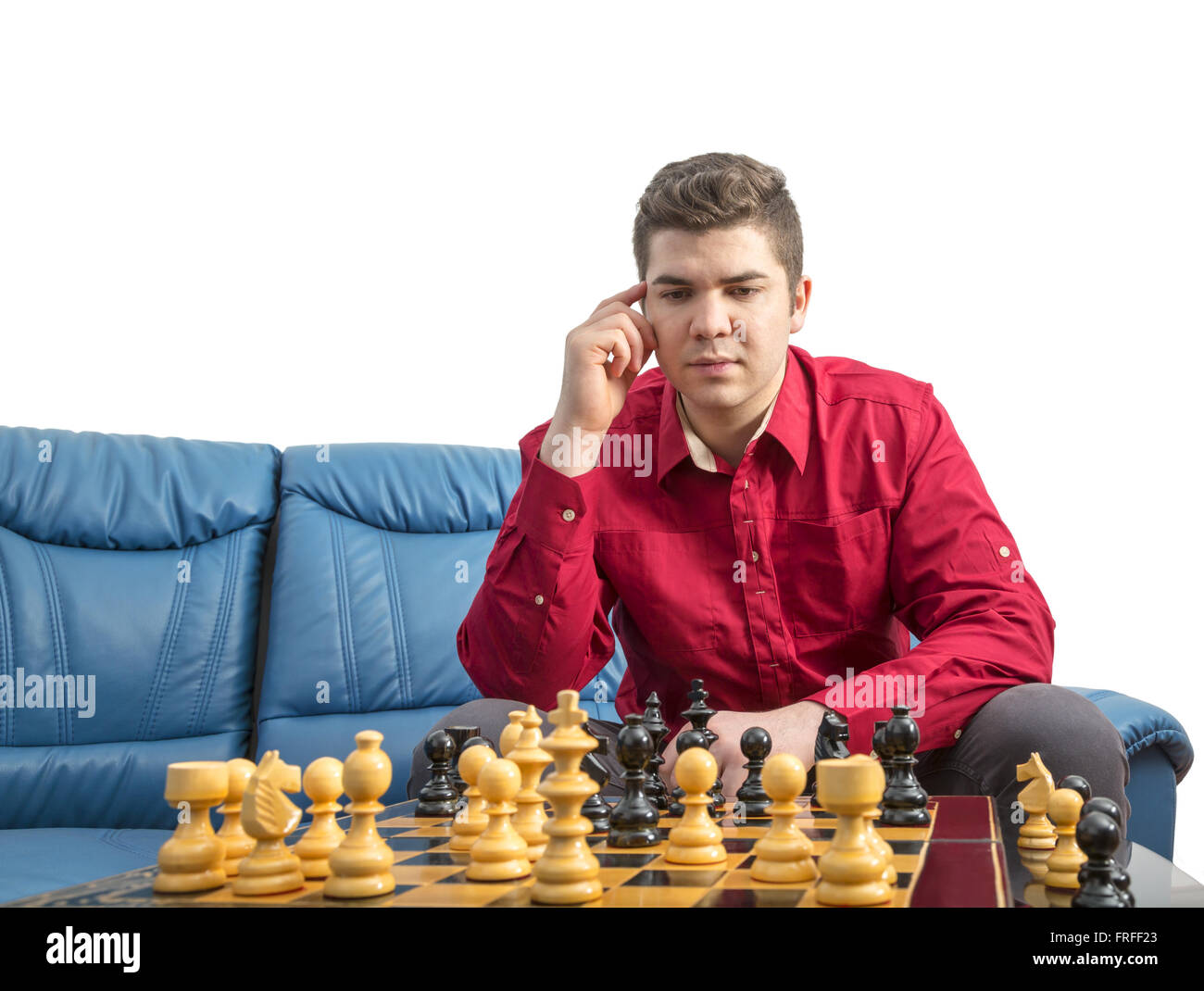 Portrait of a young man thinking during a chess match Stock Photo - Alamy