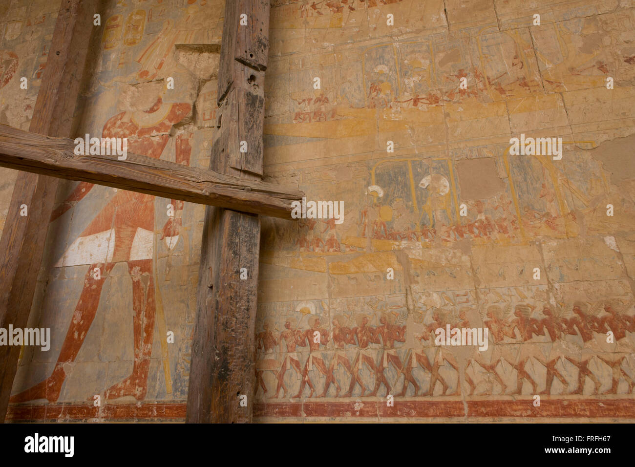 A detail of wooden supports and ancient Egyptian hieroglyphs showing ...