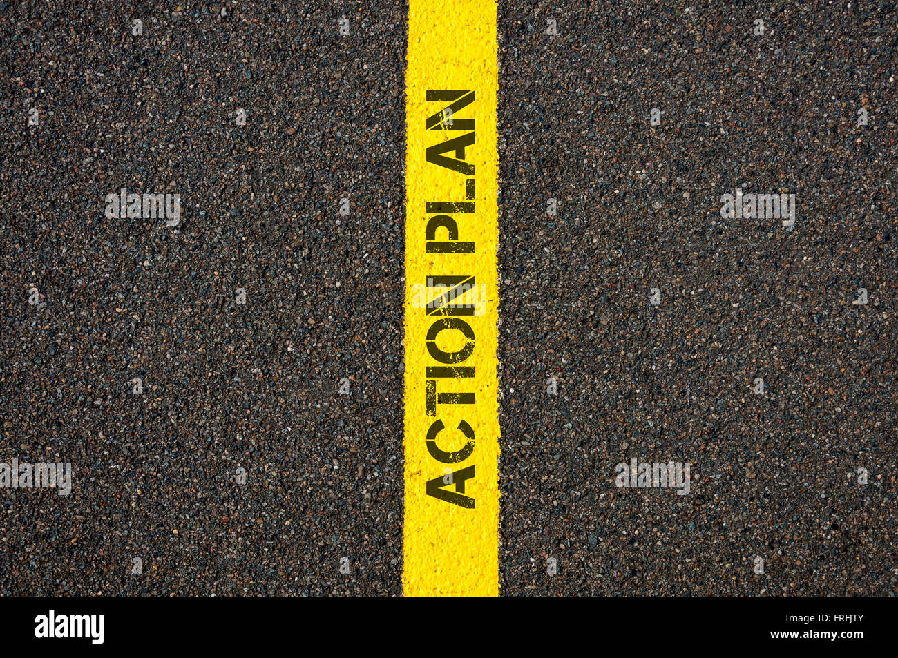 Road marking yellow paint dividing line with words ACTION PLAN ...