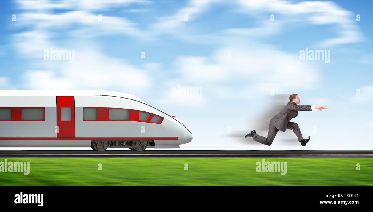 Businessman running away from train Stock Photo - Alamy