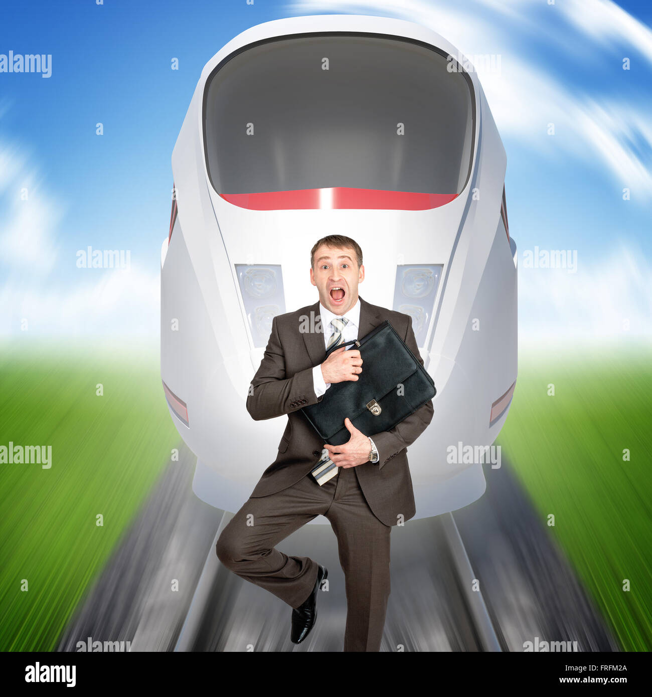 Businessman running away from train Stock Photo - Alamy