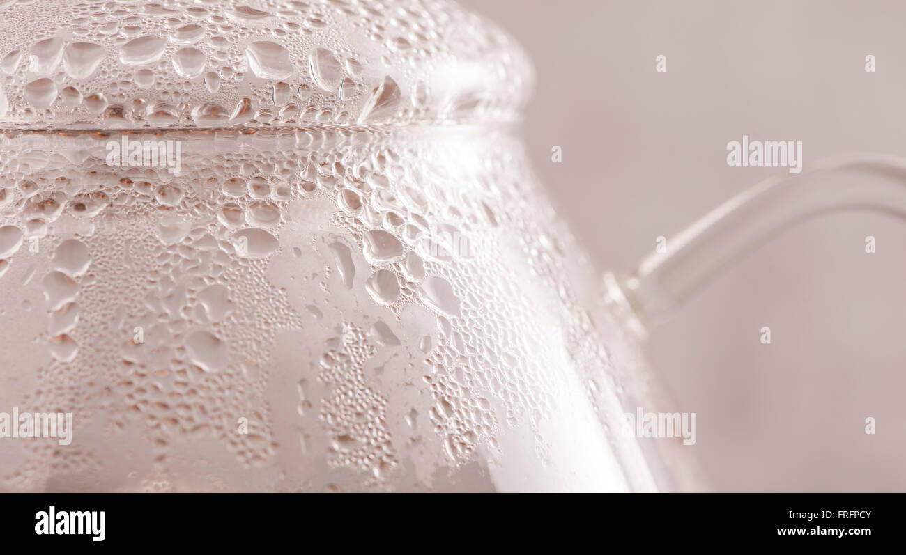 Glass tea pot with steam on the inside. Detail of kitchen object ...