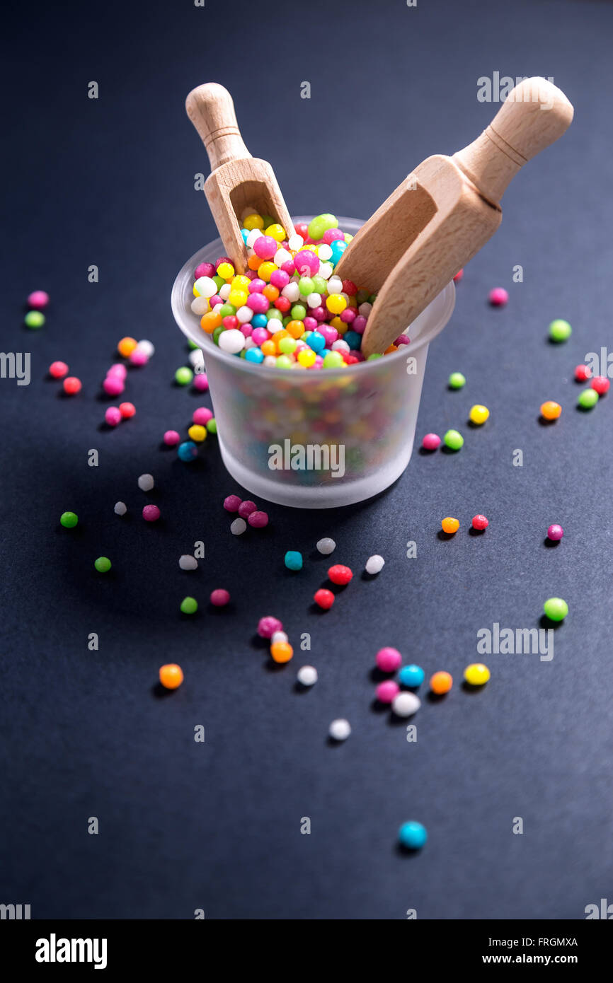Colored sugar pearls for food decoration Stock Photo - Alamy