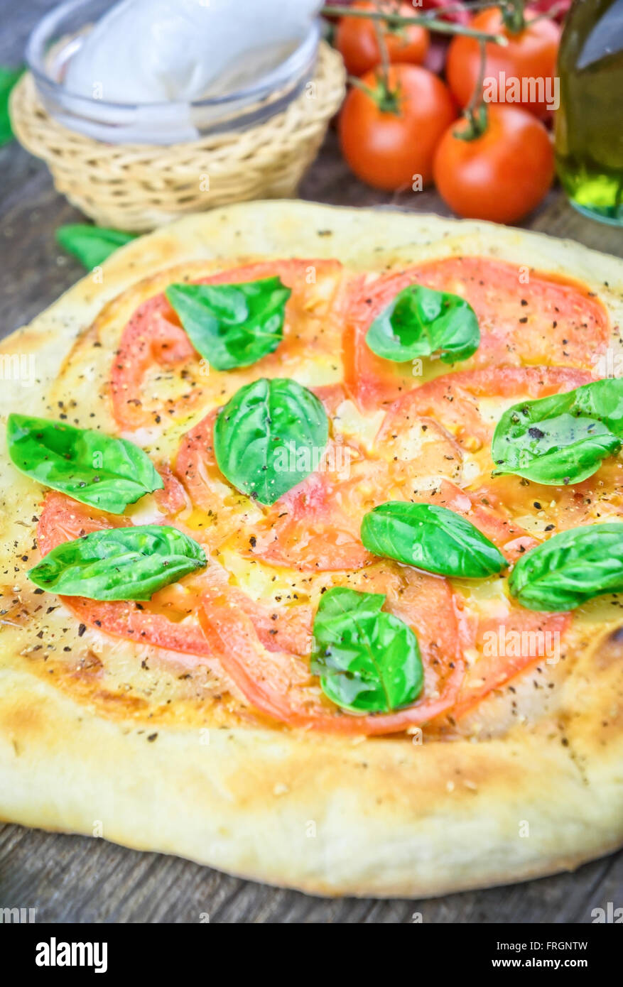Organic pizza with fresh tomatoes Stock Photo - Alamy