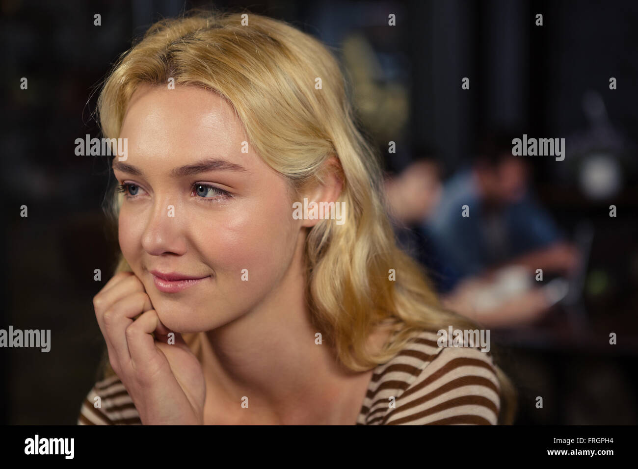 Woman touching her chin Stock Photo - Alamy Woman touching her chin Stock Photo - Alamy