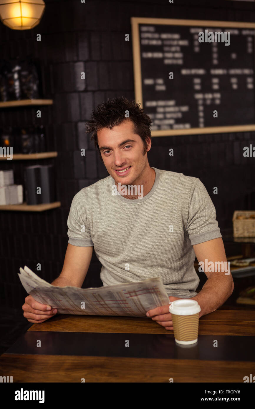 Man reading the newspaper Stock Photo - Alamy