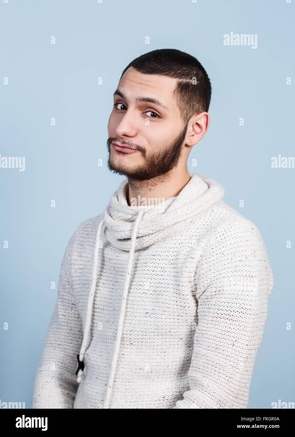 Young handsome man makes a pretty face Stock Photo - Alamy