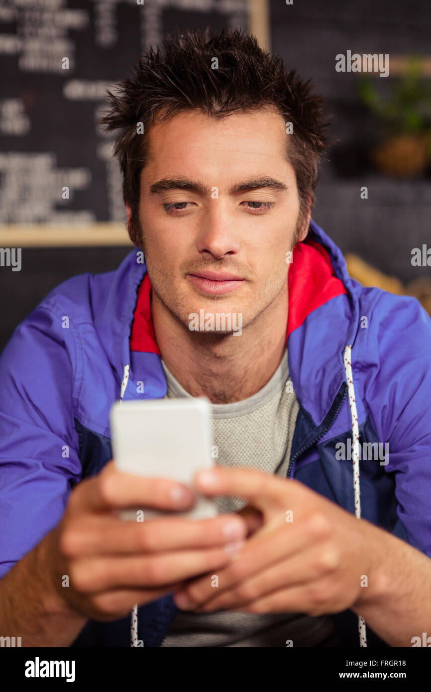 Man using his smartphone Stock Photo - Alamy