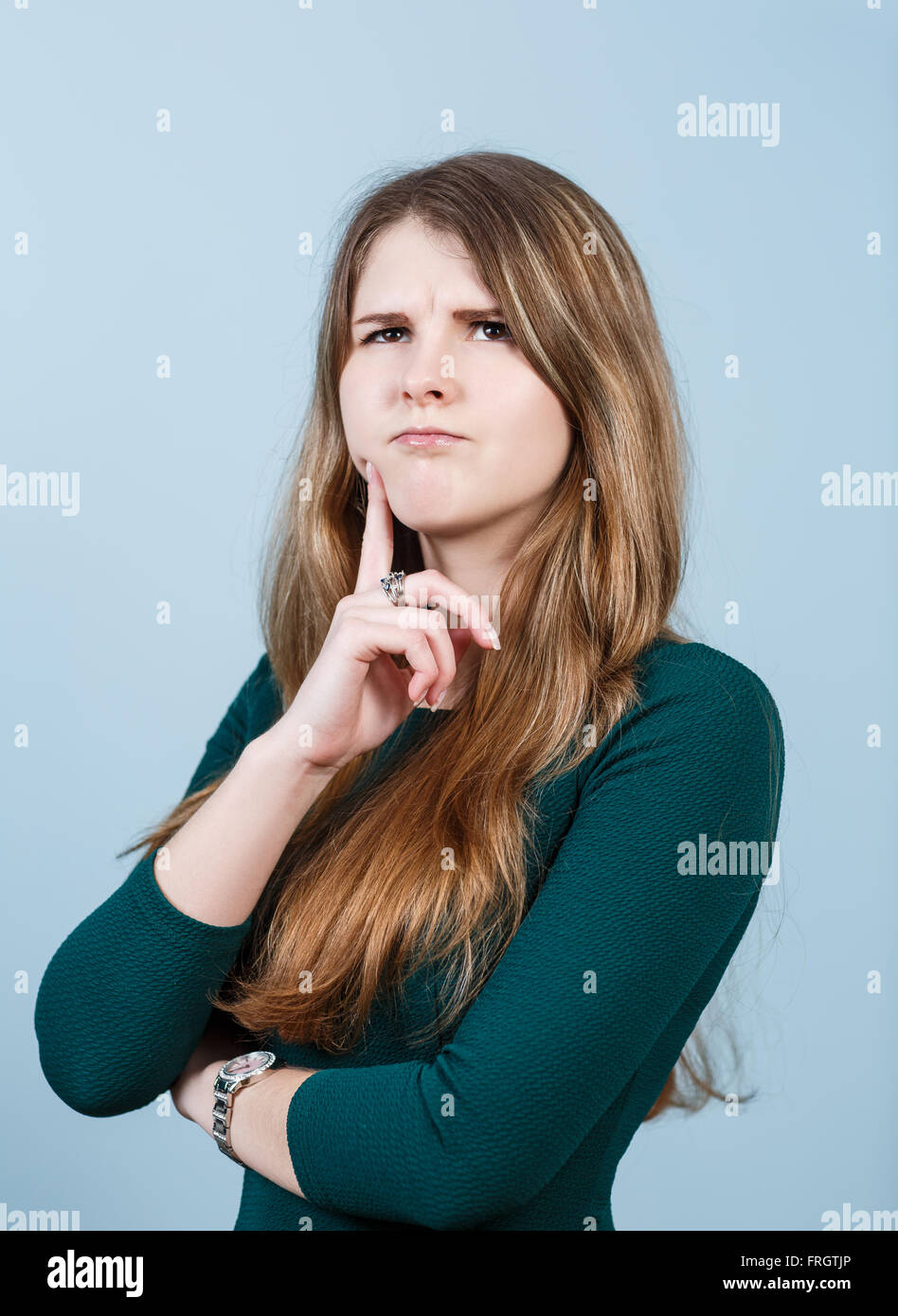 Beautiful woman thinking Stock Photo - Alamy