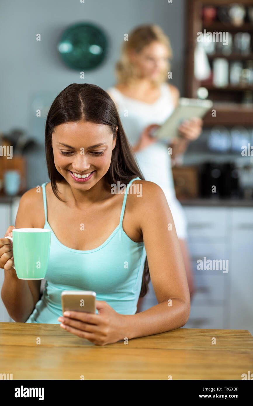 Smiling woman using mobile phone Stock Photo - Alamy