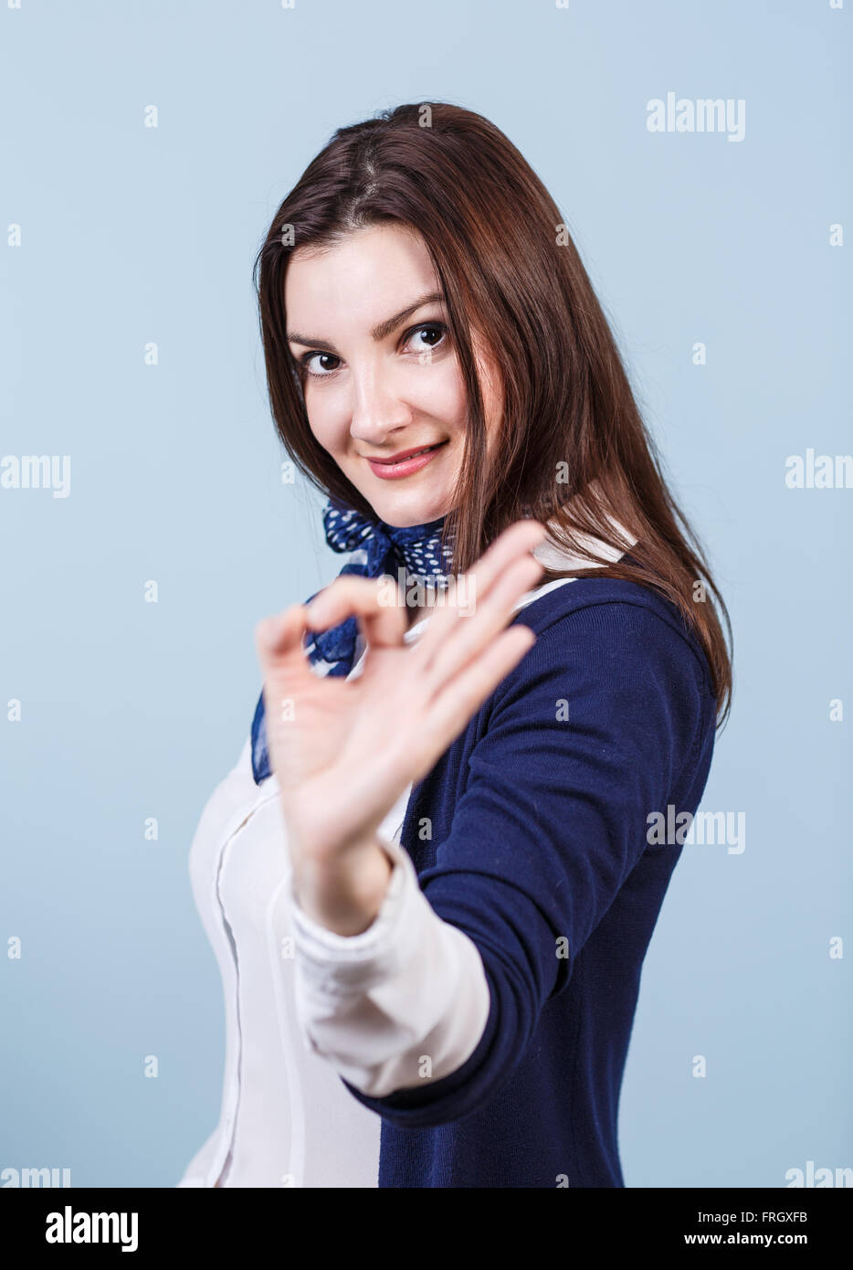 Young beautiful woman shows OK sign Stock Photo - Alamy