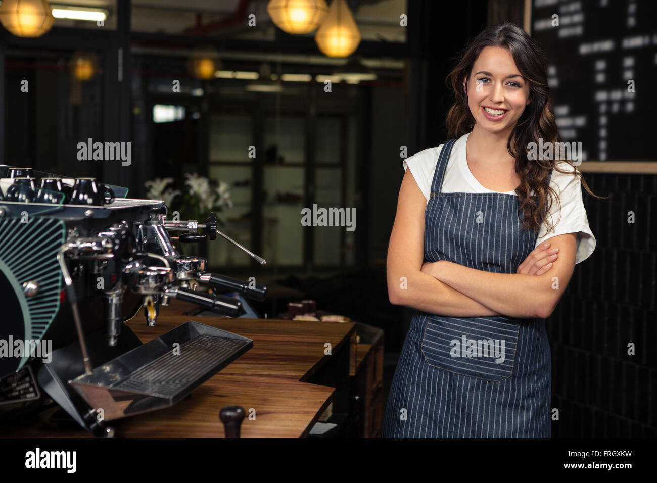 Portrait smiling female barista standing hi-res stock photography and ...