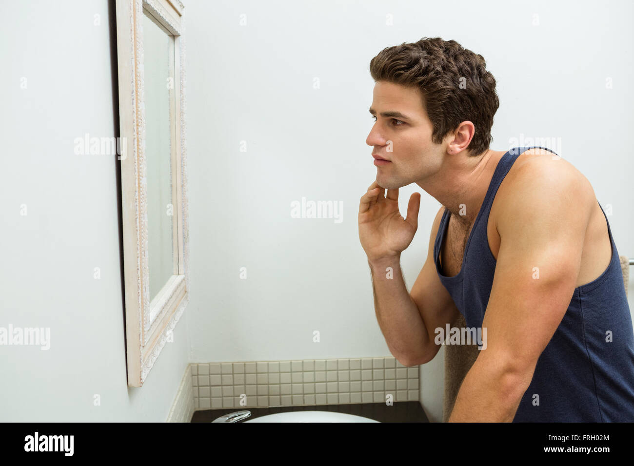 Man checking his stubble in bathroom Stock Photo - Alamy