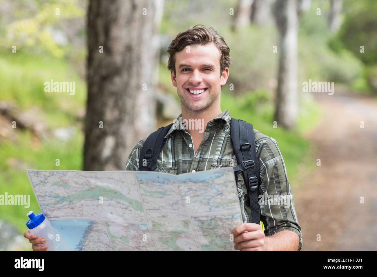 Young man looking at map hi-res stock photography and images - Alamy