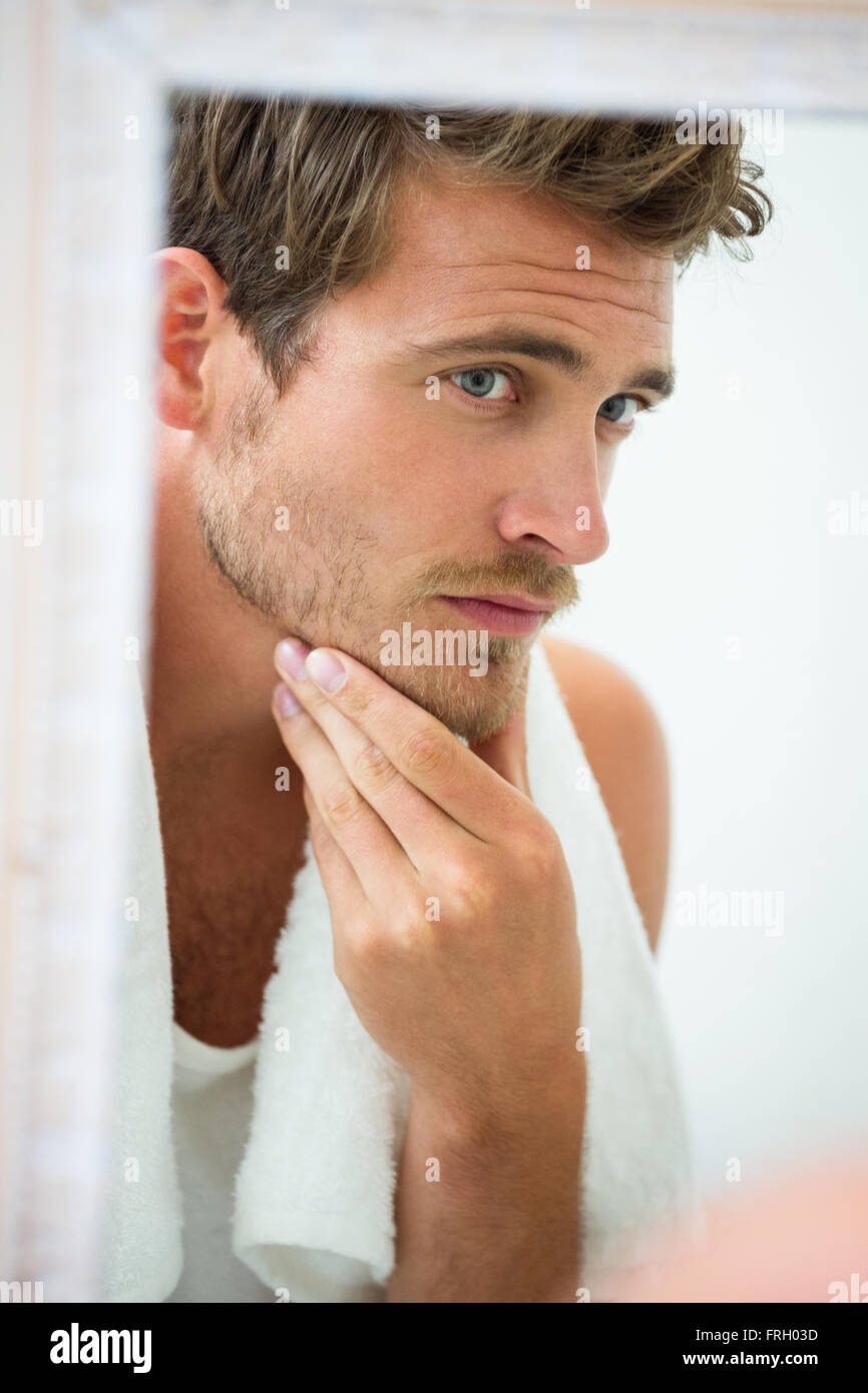 Man checking his stubble in bathroom Stock Photo - Alamy