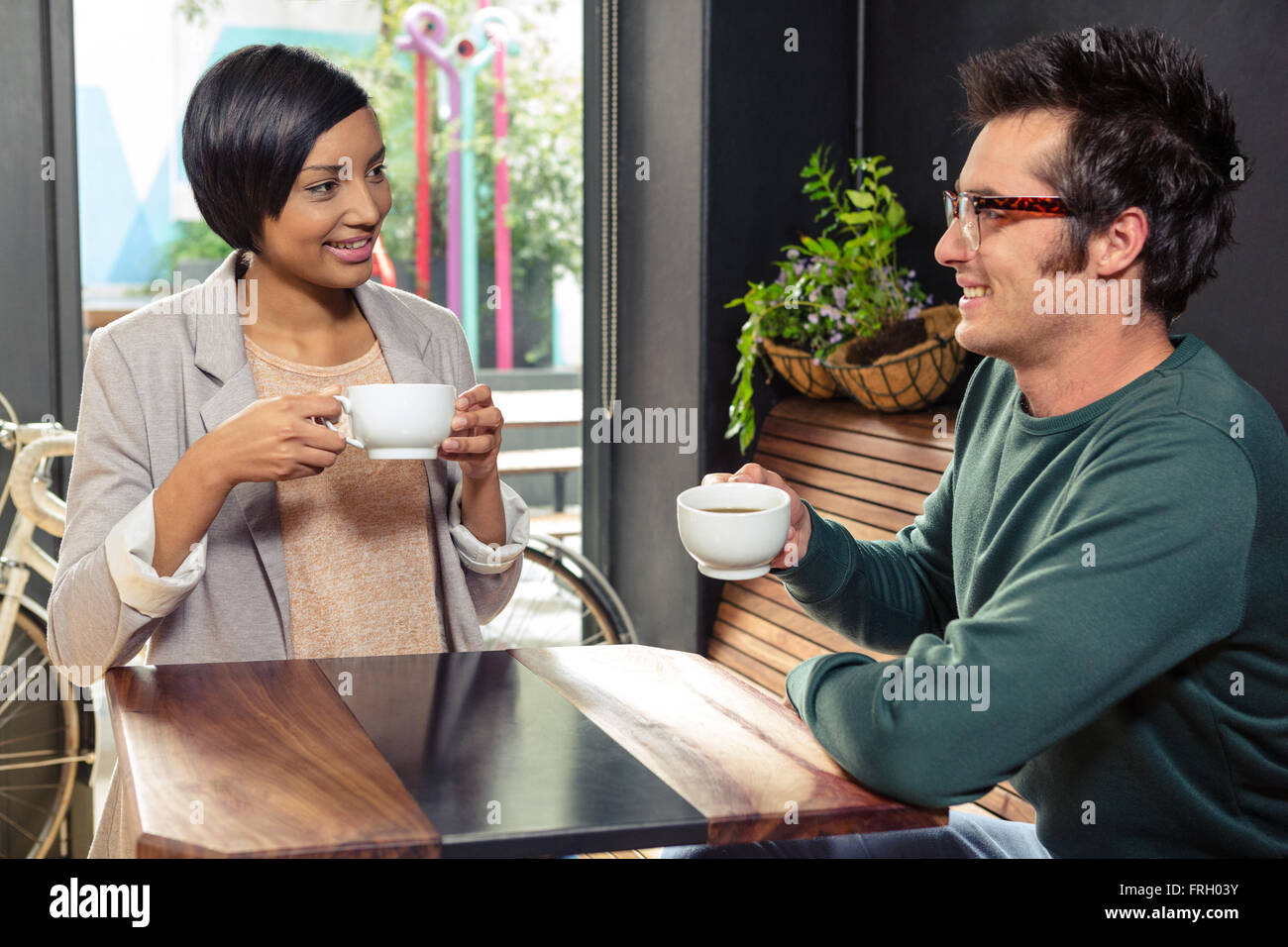 Couple having a coffee together Stock Photo - Alamy