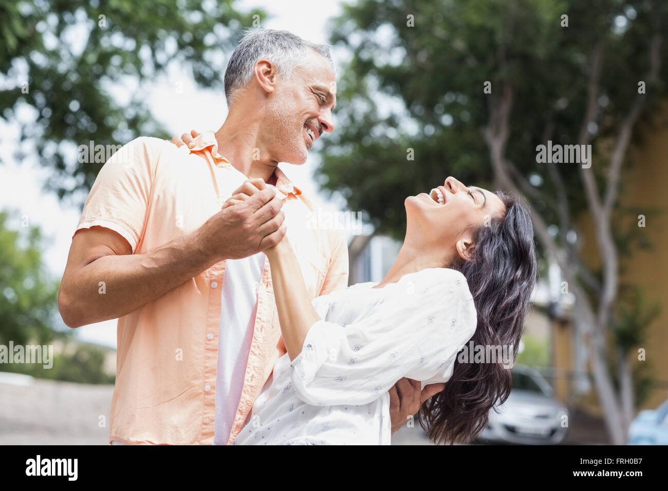 Cheerful couple dancing Stock Photo - Alamy