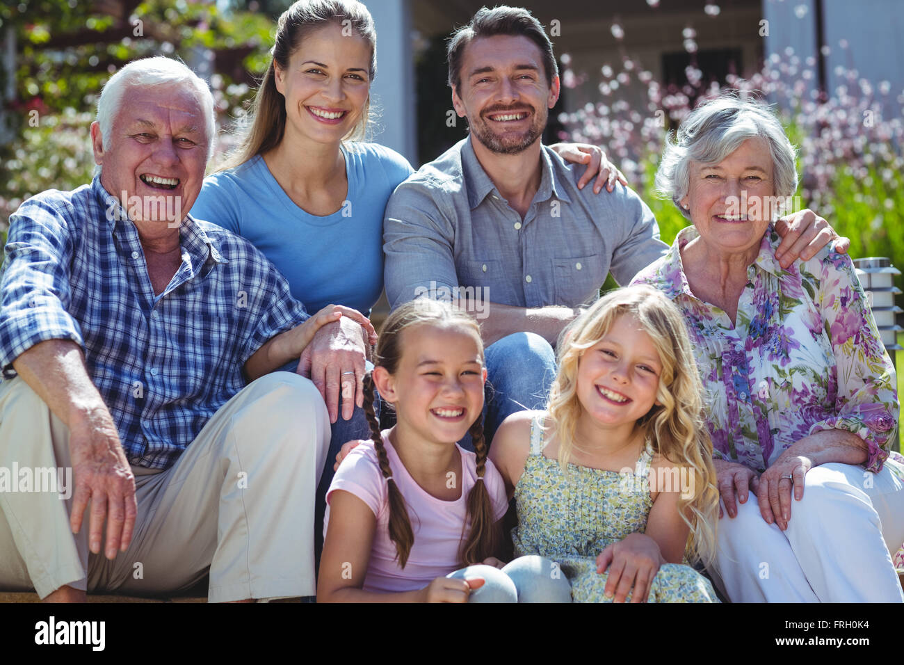 Portrait of happy family in back yard Stock Photo - Alamy