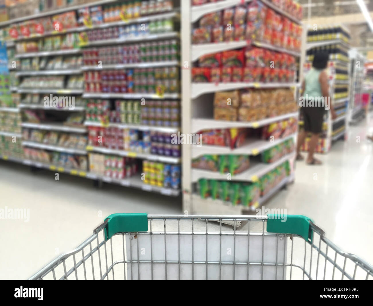 blurred photo of store with trolley in department store Stock Photo - Alamy