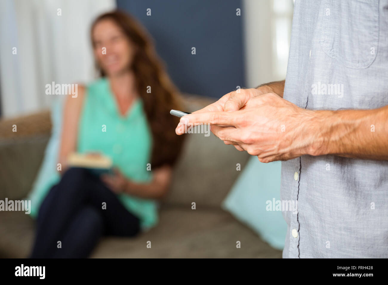 Man text messaging on mobile phone Stock Photo - Alamy