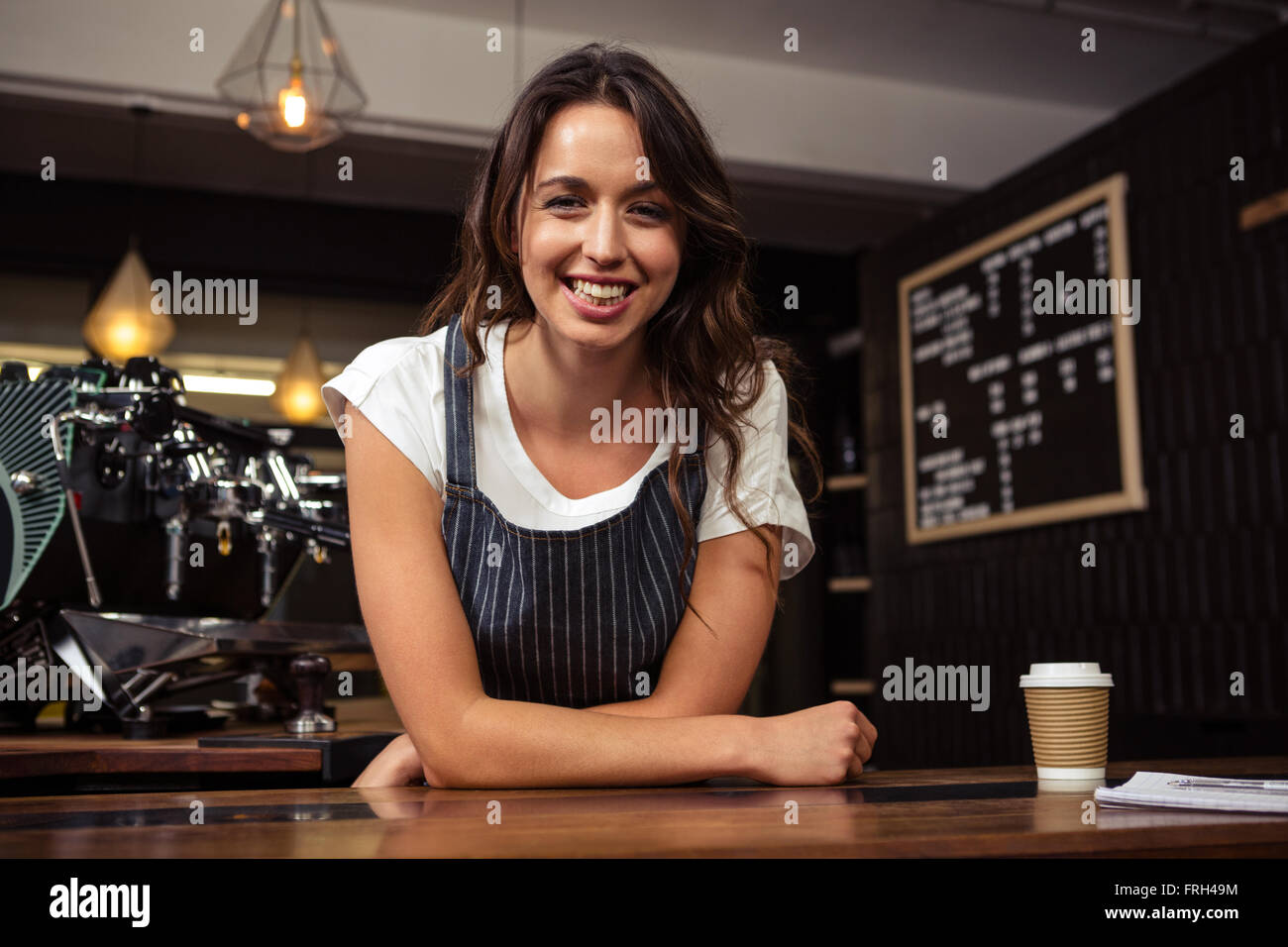 Portrait of smiling barista Stock Photo - Alamy