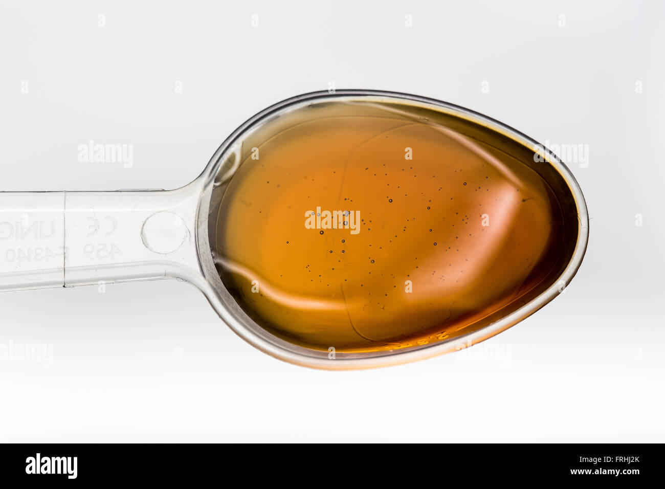 Spoonful of syrup Stock Photo - Alamy