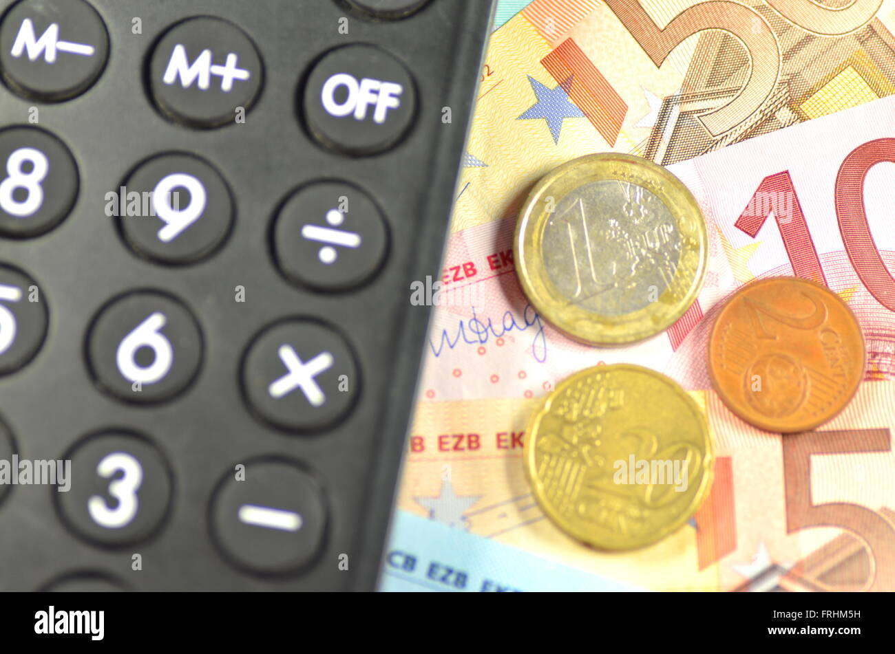 euro banknotes, coins and calculator Stock Photo - Alamy