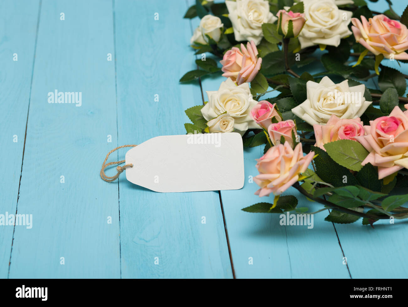white blank card with flowers on a wooden blue background Stock Photo ...