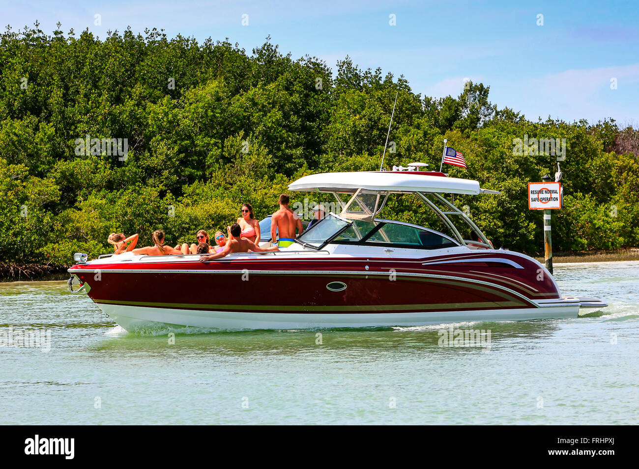 Young people on spring-break enjoy boating around Little Marco Island ...
