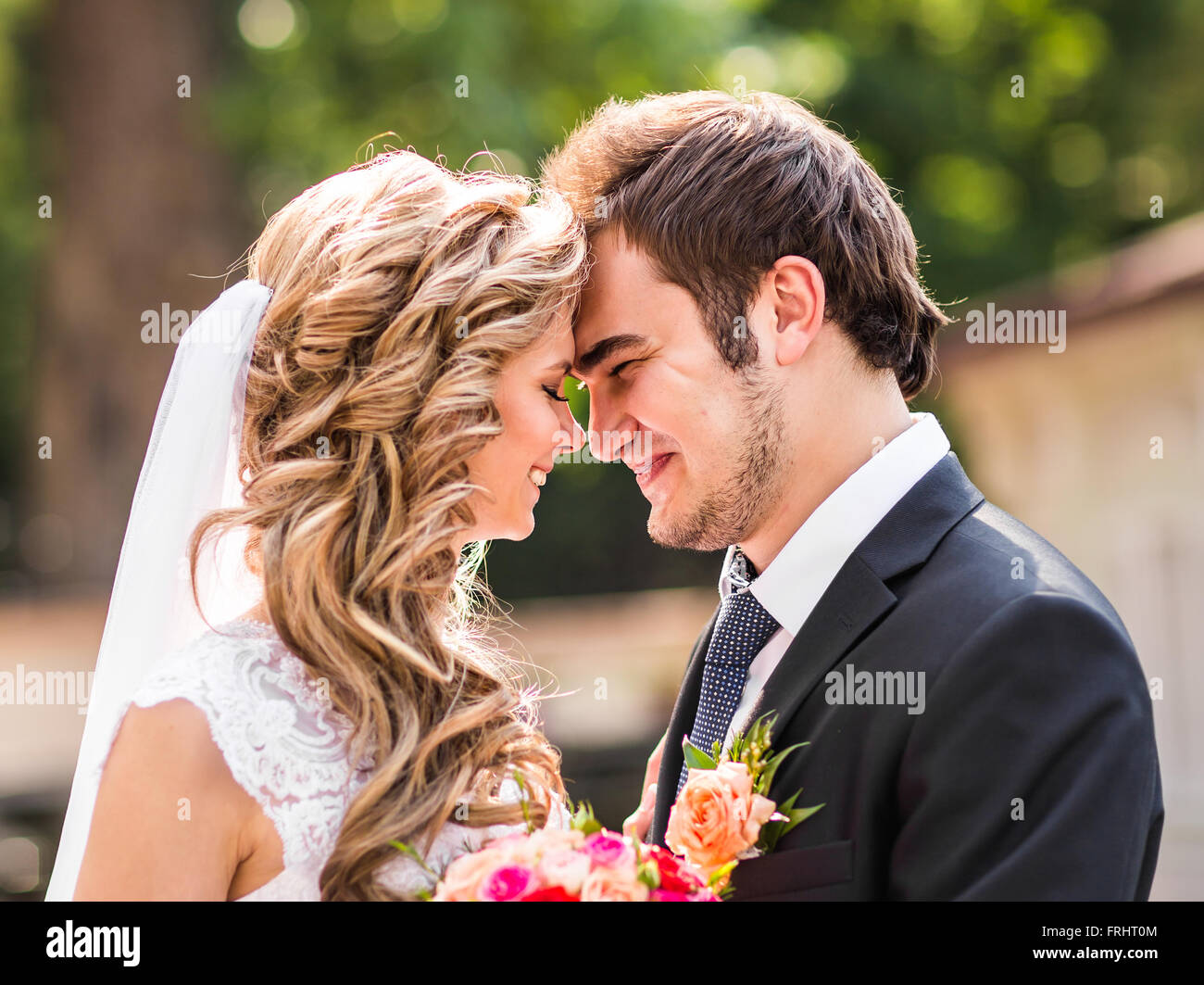 Just married couple embraced Stock Photo - Alamy