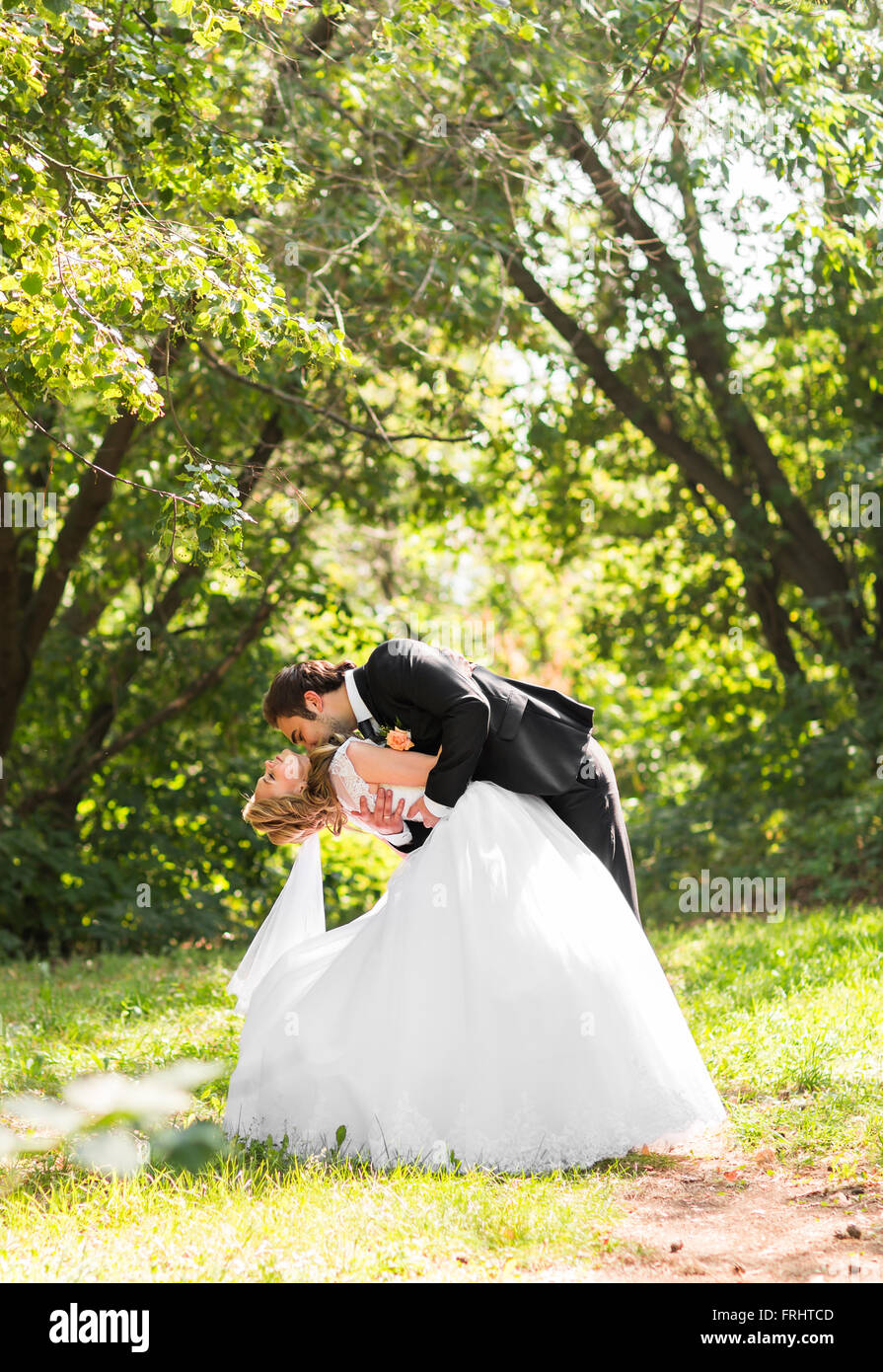 Just married couple embraced Stock Photo - Alamy