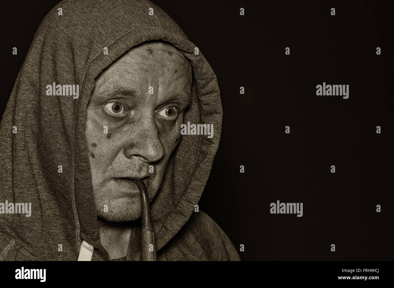 Sepia toned portrait of mature man meditating in darkness Stock Photo ...