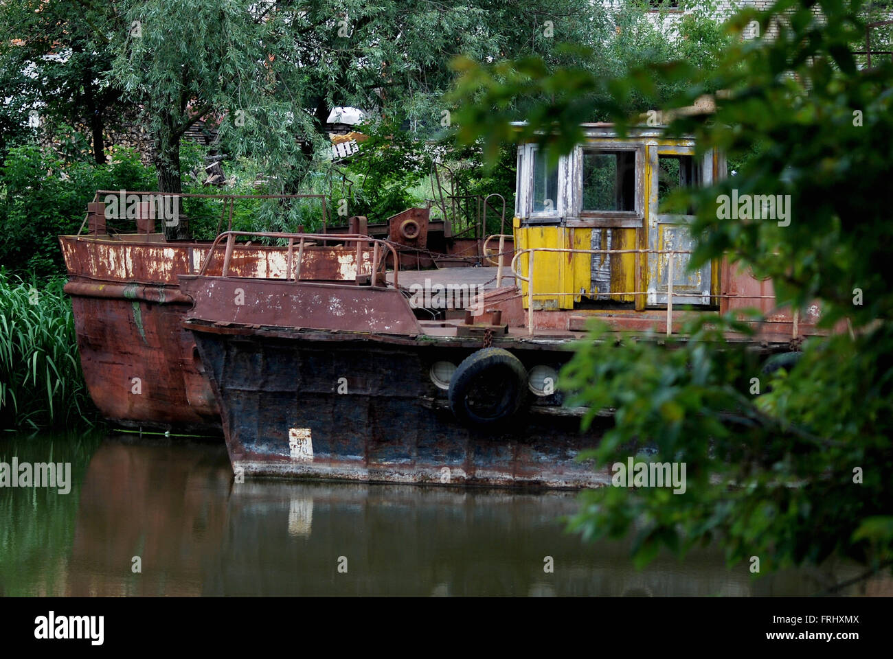Old rusty barge and tug Stock Photo - Alamy