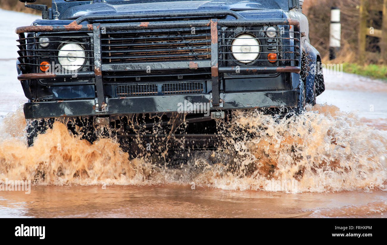 Vehicle Driving Through Flood Water On Road Stock Photo - Alamy