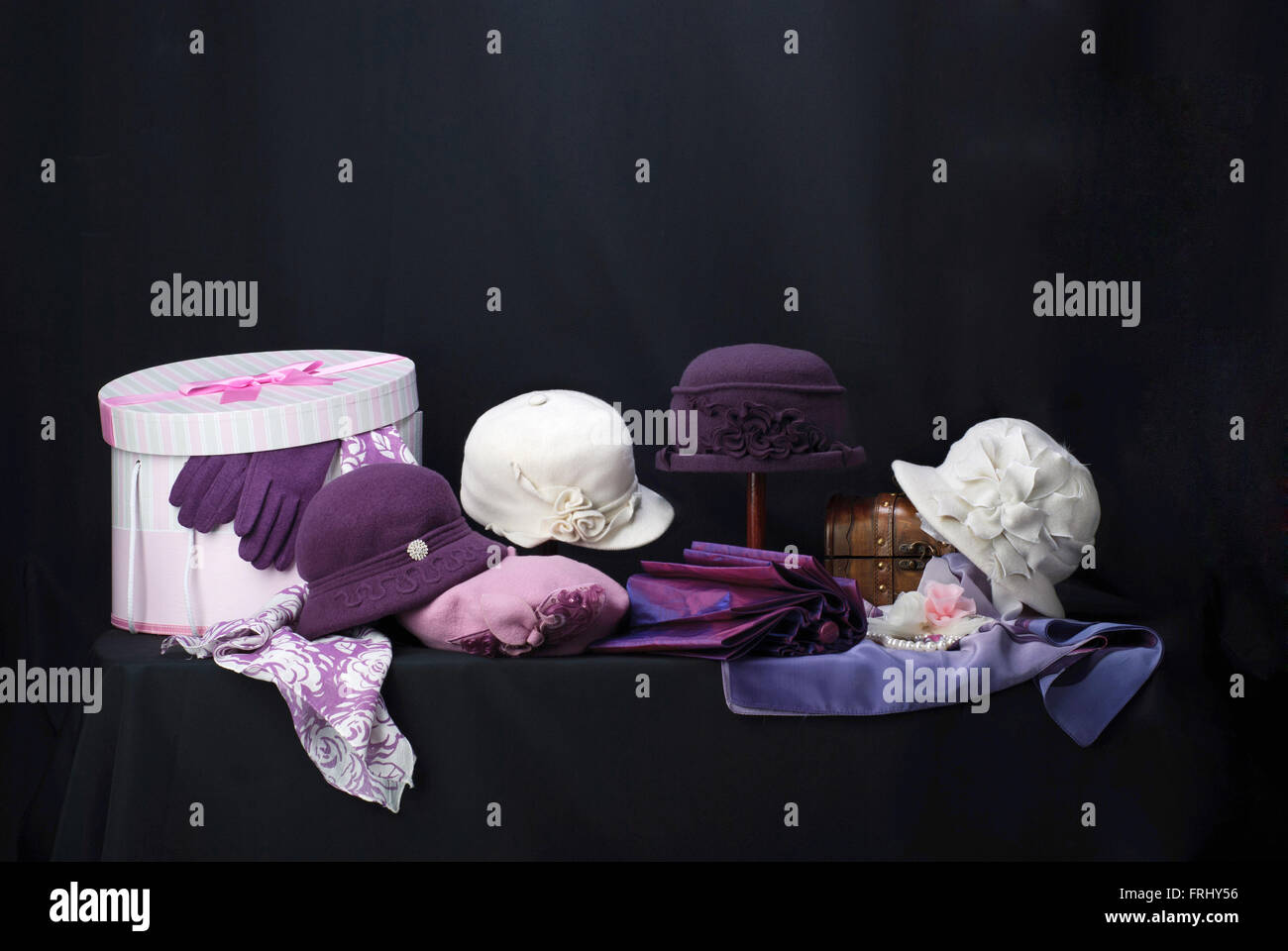 women's hats table black background hat case Stock Photo - Alamy