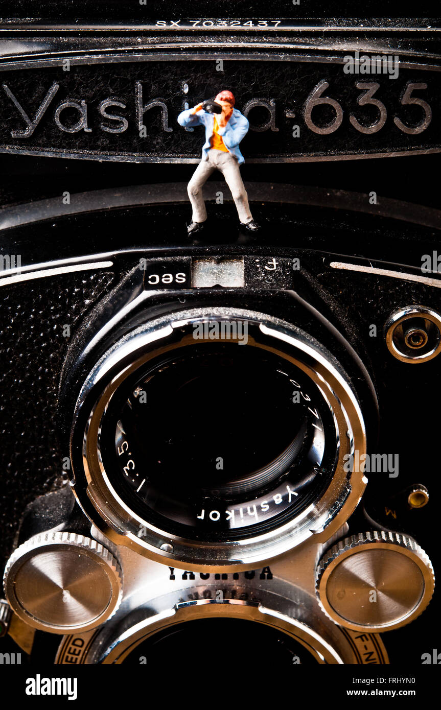 photographer figurine on a photo camera, photography concept Stock ...