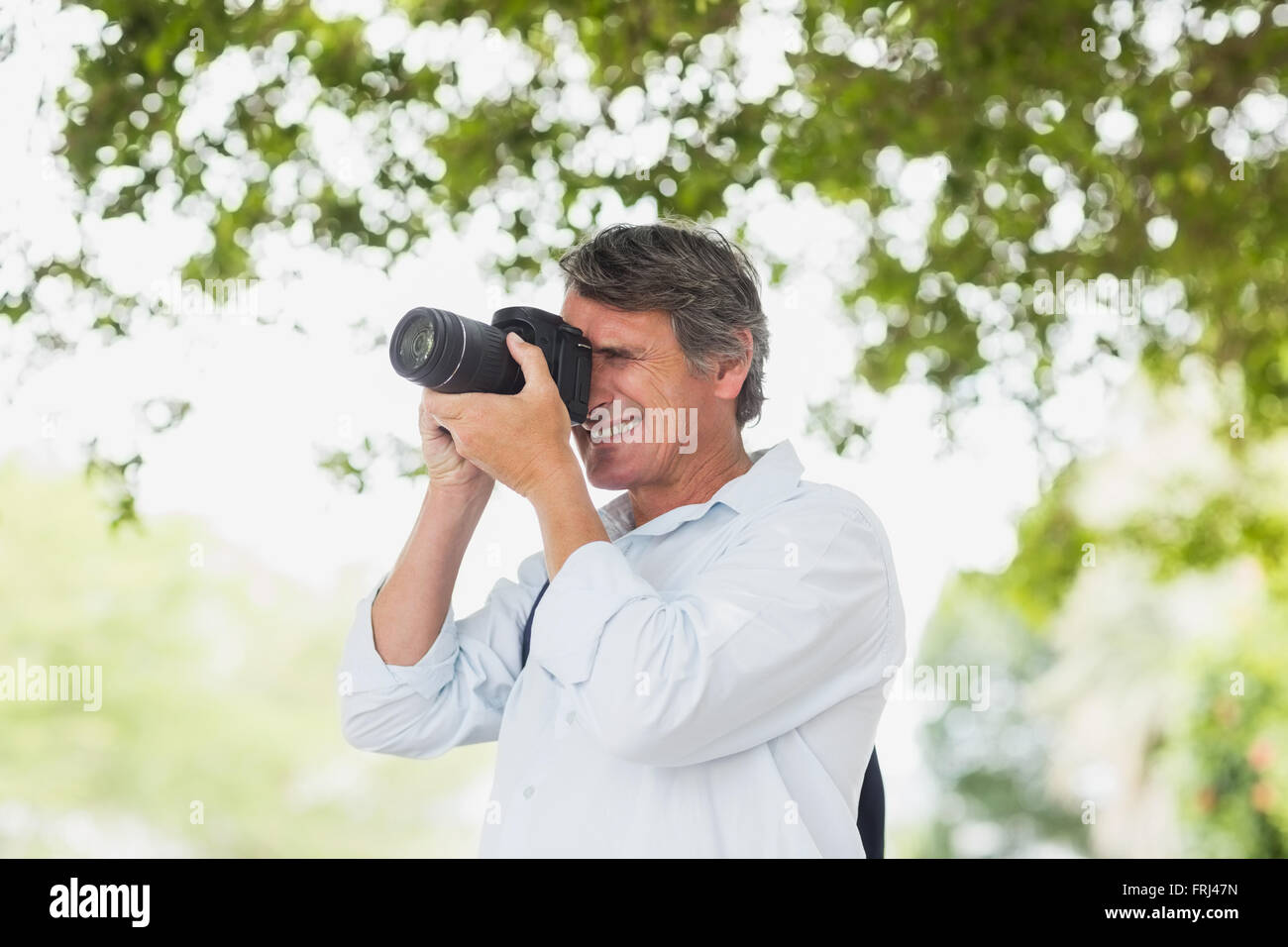 Man using camera Stock Photo - Alamy