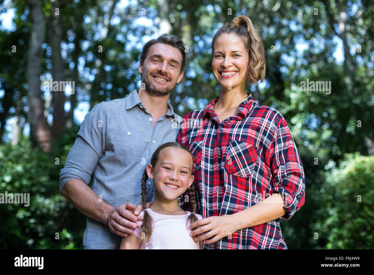Portrait of happy family in back yard Stock Photo - Alamy