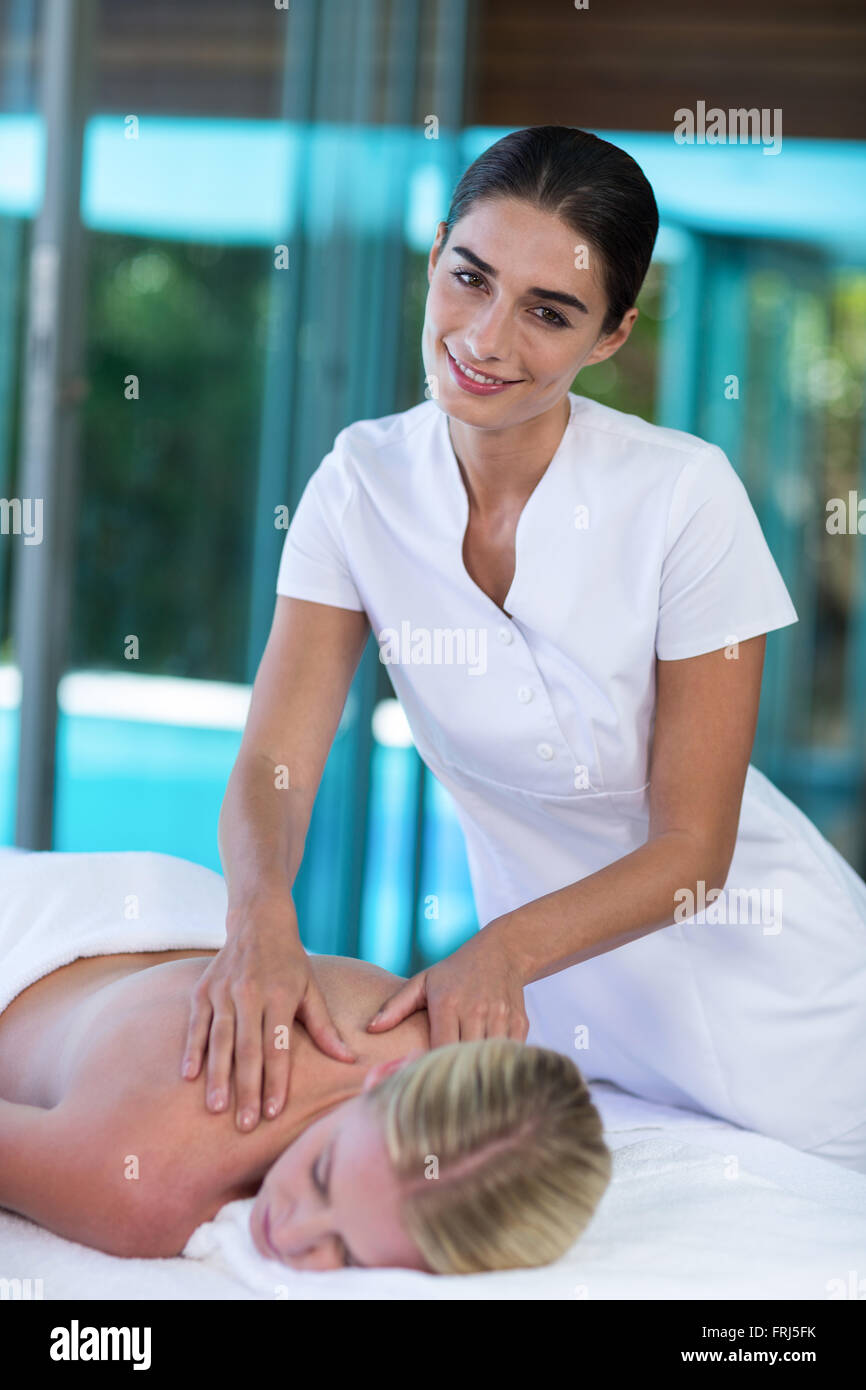 Woman receiving back massage from masseur Stock Photo - Alamy