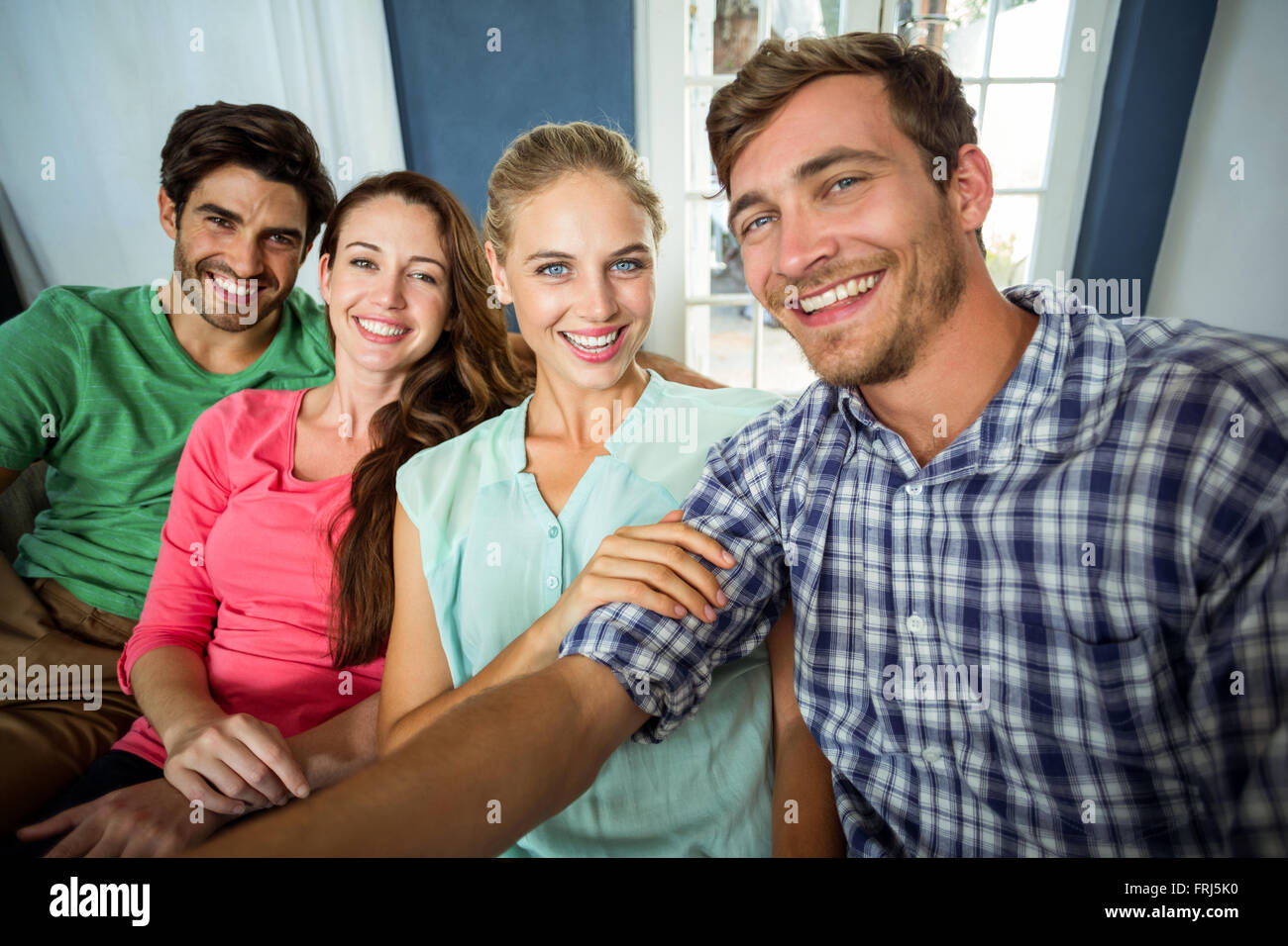 Portrait smiling friends relaxing hi-res stock photography and images ...