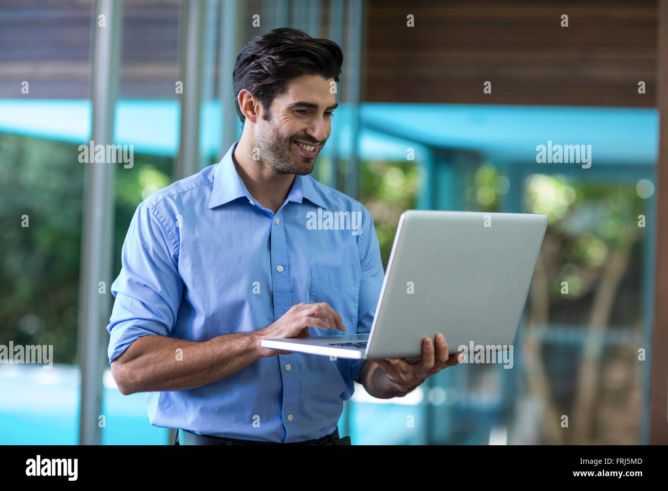 Smart man using laptop Stock Photo - Alamy