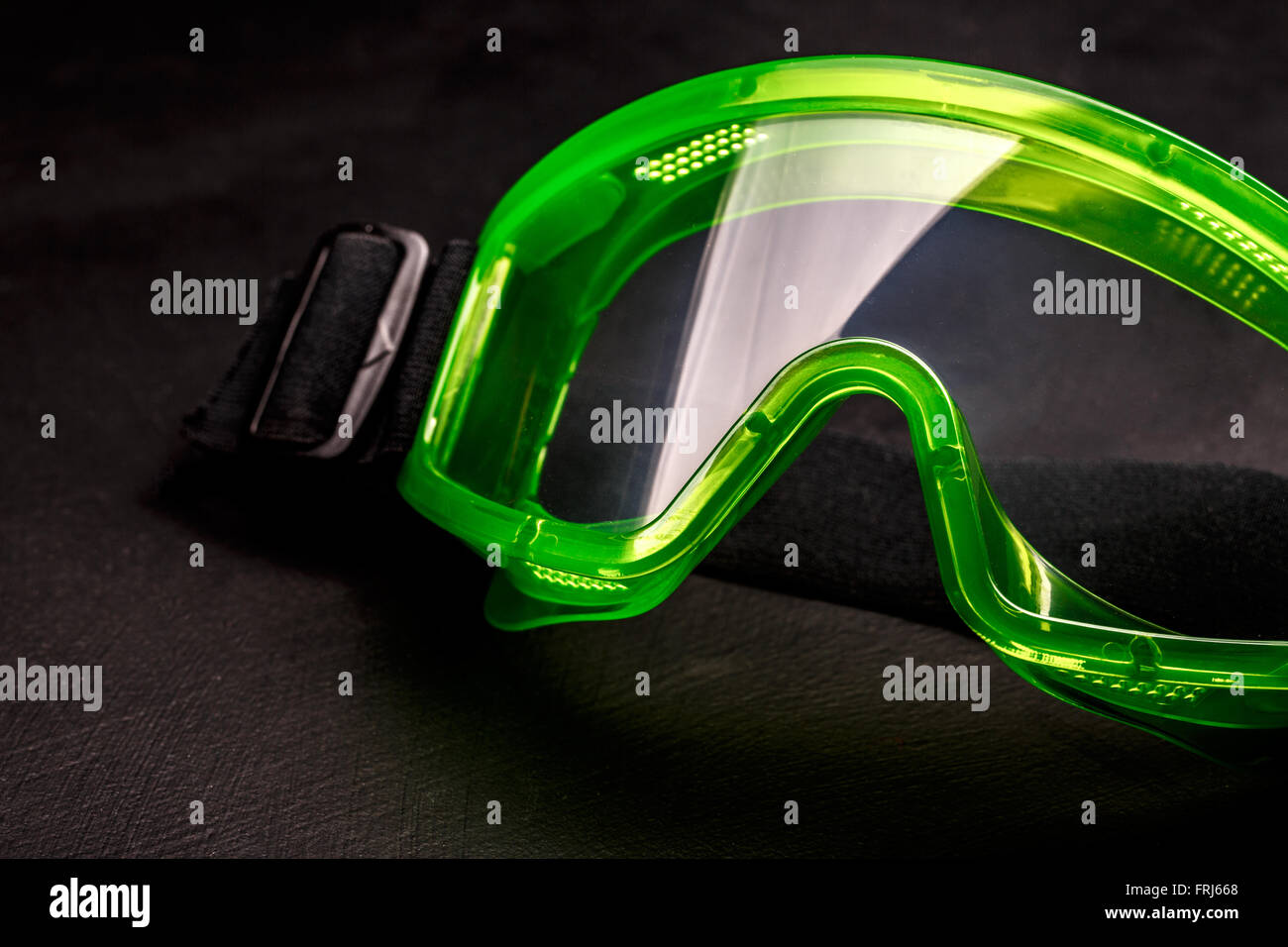 Green safety eye shields with strap in closeup Stock Photo - Alamy