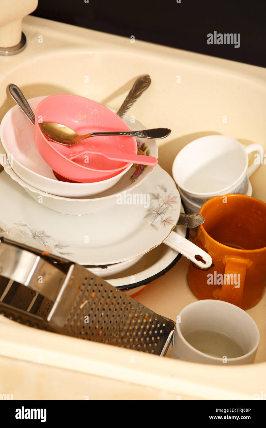 Dirty dishes in kitchen sink in closeup Stock Photo - Alamy