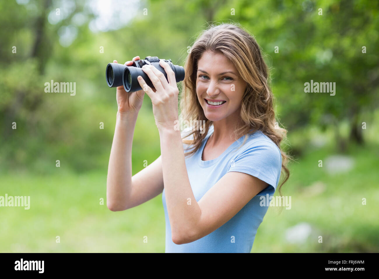 Young woman binoculars outdoors hi-res stock photography and images - Alamy